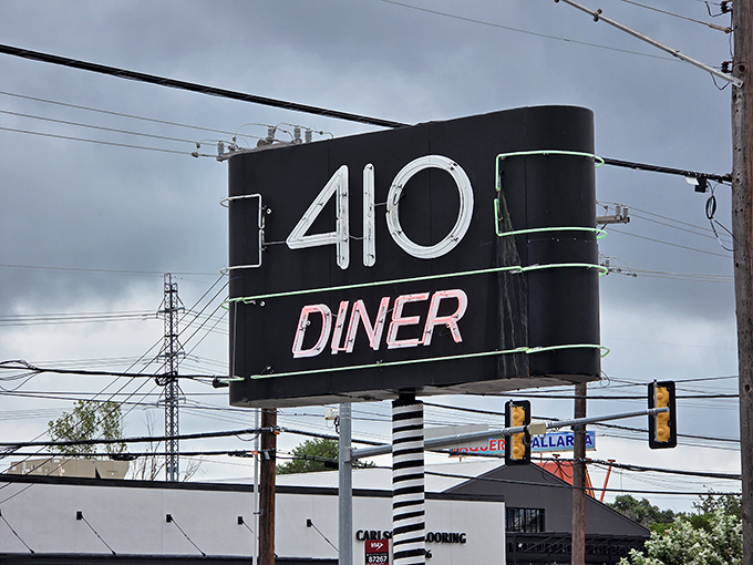 That neon sign isn't just advertising—it's a beacon of hope for hungry travelers and a landmark for locals giving directions.