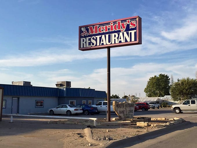 The iconic Meridy's sign stands tall against the Kansas sky, a landmark that's guided hungry travelers for generations.