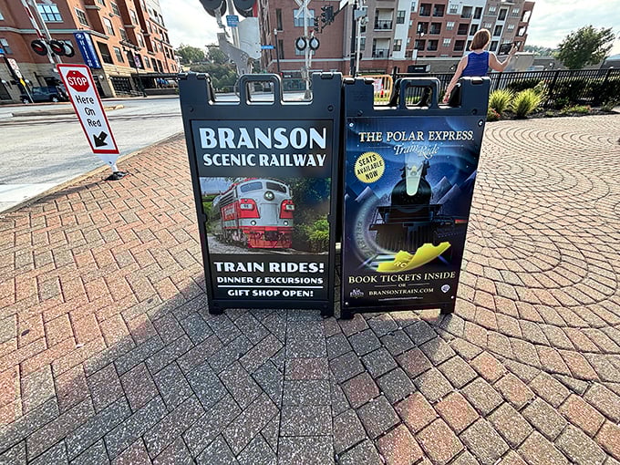 Sidewalk signage announces two magical journeys: scenic daytime adventures and nighttime trips to the North Pole. Choose your adventure!