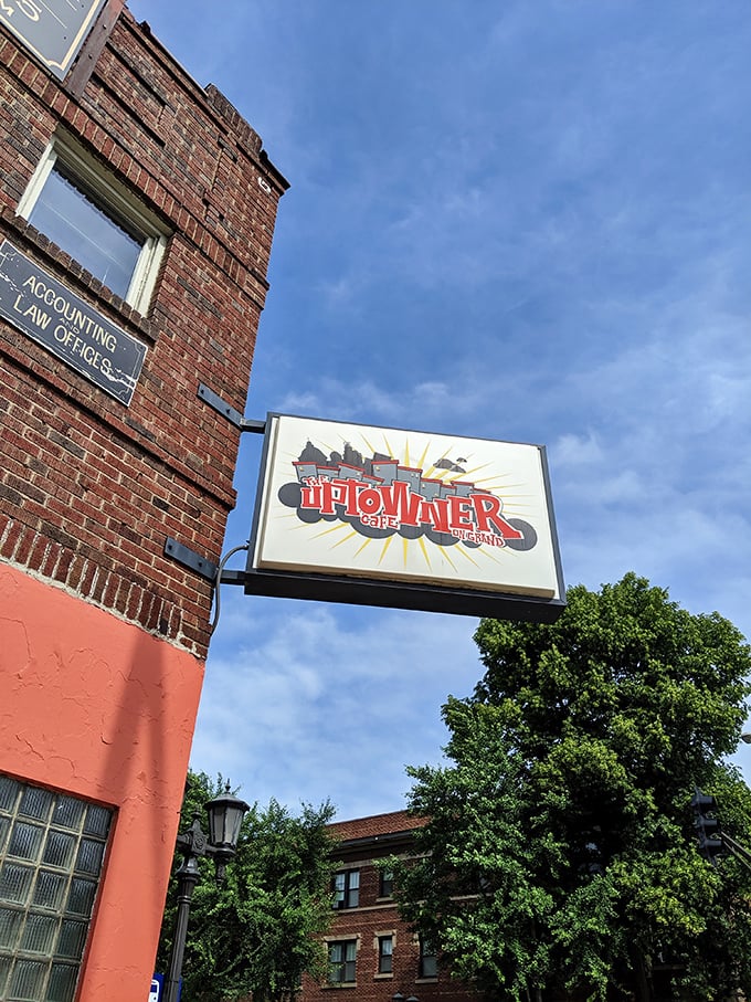 The sign promises what the kitchen delivers—a cafe and pub where memories are made between bites of perfectly executed comfort food.