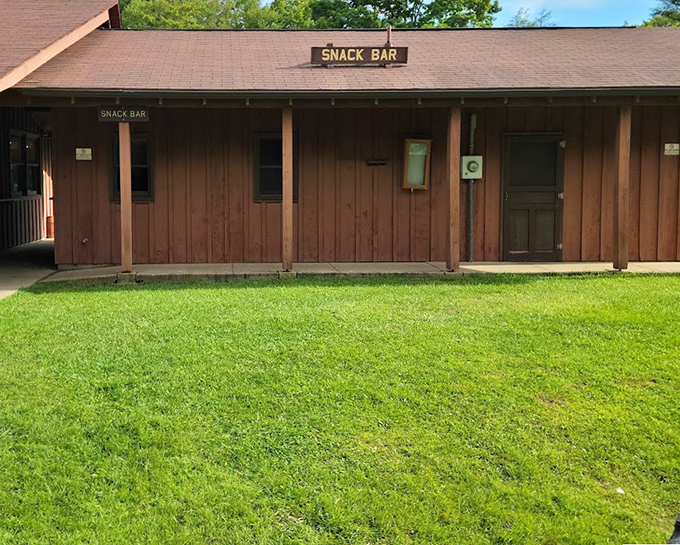 The humble snack bar—where trail mix meets hot chocolate. After conquering those 214 steps, that "SNACK BAR" sign looks like a beacon of hope.