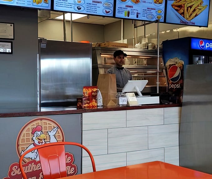 The person behind the counter isn't just taking orders—they're the gatekeeper to chicken paradise.