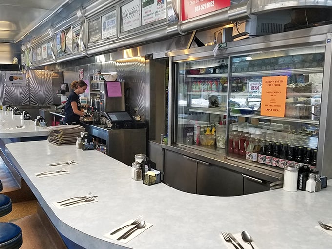 Where the magic happens—skilled hands preparing comfort food classics with the efficiency that comes only from years of experience. No fancy culinary school required.