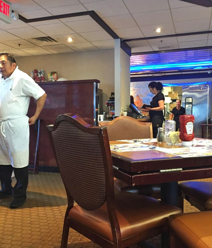 The heart of any great diner is its staff—moving with practiced efficiency while maintaining the warmth that keeps customers coming back for decades.