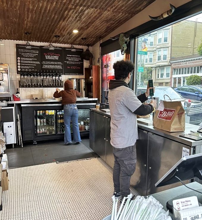 The takeout counter – where hope meets hunger and brown paper bags become treasure chests filled with smoky gold.