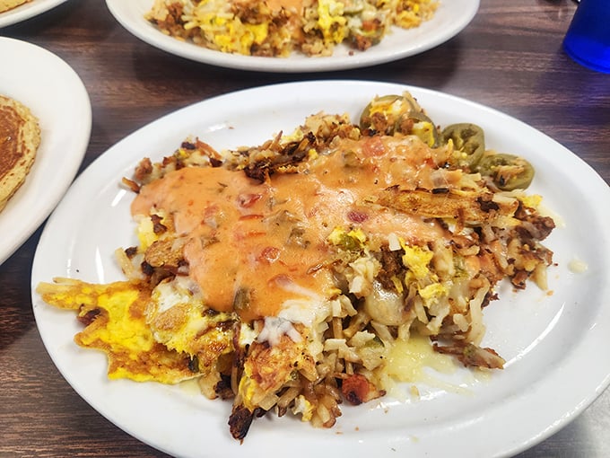 Stan's Hash isn't just breakfast—it's an architectural marvel of potatoes, eggs, and cheese that makes you wonder why you'd ever eat anything else before noon.