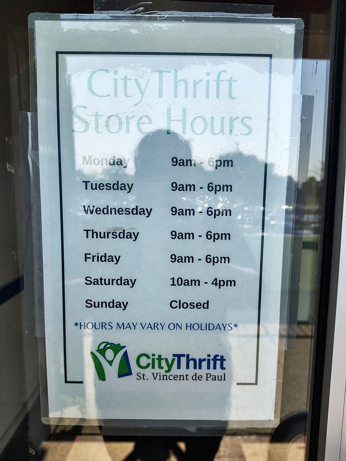 Store hours posted clearly—the sacred schedule that serious thrifters commit to memory like devout followers of a particularly affordable religion.