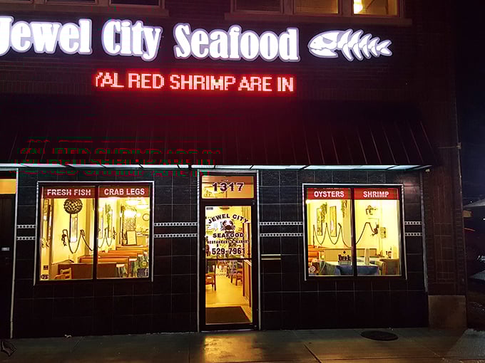 The evening glow announces that royal red shrimp have arrived. Like a Vegas marquee for seafood lovers, this sign promises jackpots of flavor inside.