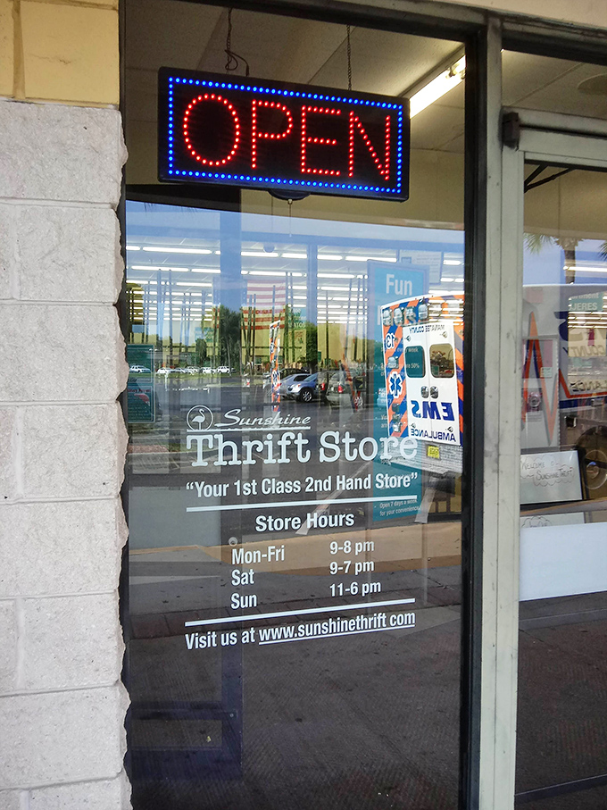 Store hours posted clearly—because knowing when you can return for your next thrifting fix is essential information.