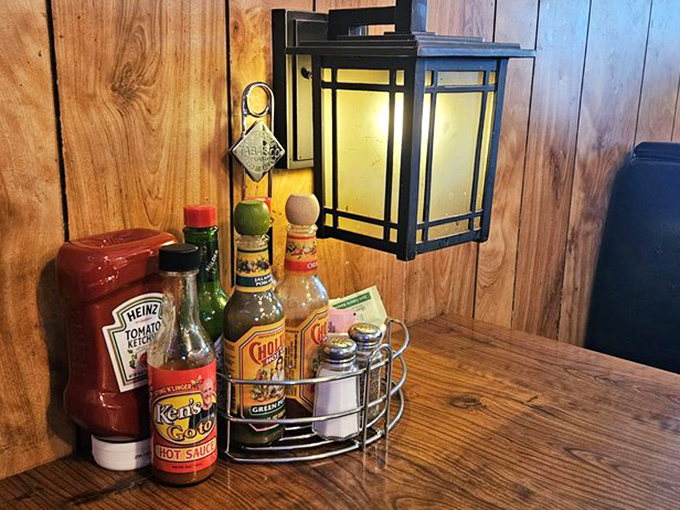 The condiment caddy—that unsung hero of breakfast tables everywhere. Hot sauce options are the true measure of a diner's character.