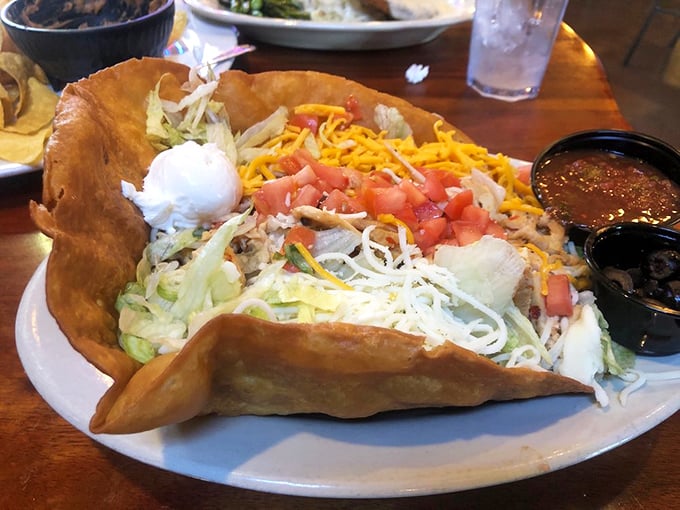 The taco salad arrives in a crispy shell large enough to have its own zip code—a mountain of freshness that's as impressive as the Rockies.