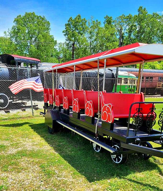 All aboard the museum's charming tour train—those red seats have carried generations of wide-eyed visitors through railroad history.