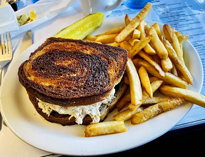 A perfectly grilled tuna melt with golden fries that proves Norm's isn't just a breakfast one-hit wonder—their lunch game deserves its own fan club.