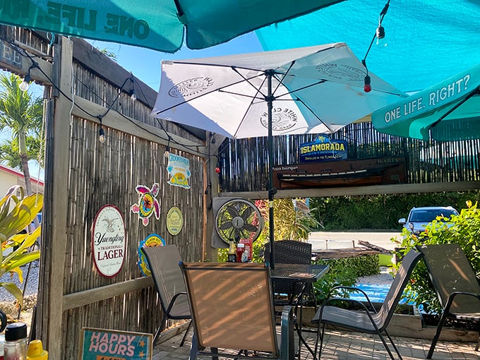 Outdoor dining, island style – where plastic chairs feel like thrones and every meal comes with a side of tropical breeze.