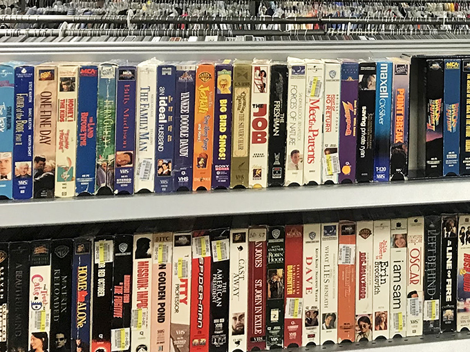 The VHS collection—a nostalgic time capsule of movie nights past, when "be kind, rewind" was more than just a suggestion.