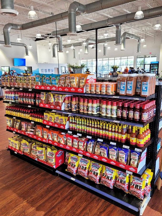 Grocery aisles stocked with coastal essentials—the kind of place where you come for lunch and leave with bags of seafood seasonings and sauces.