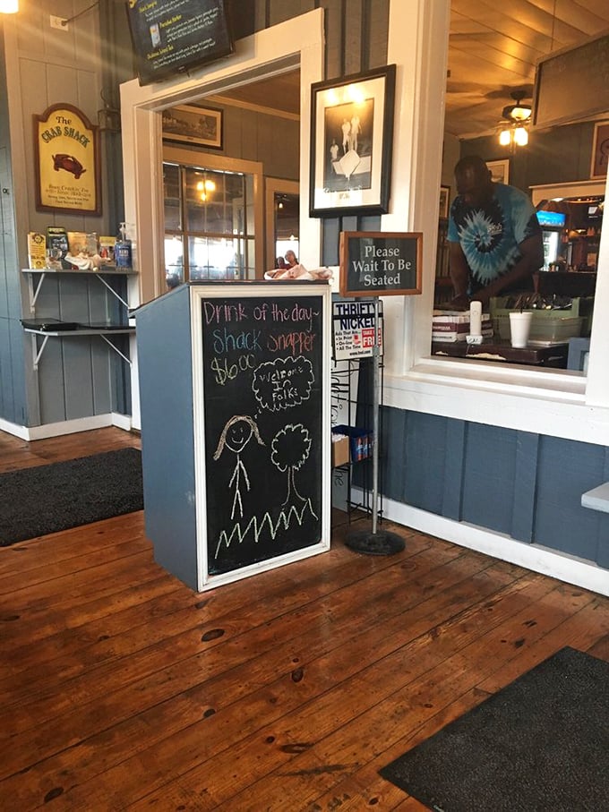 A waiting area that somehow makes anticipation part of the experience—complete with chalkboard specials that tempt you before you're even seated.