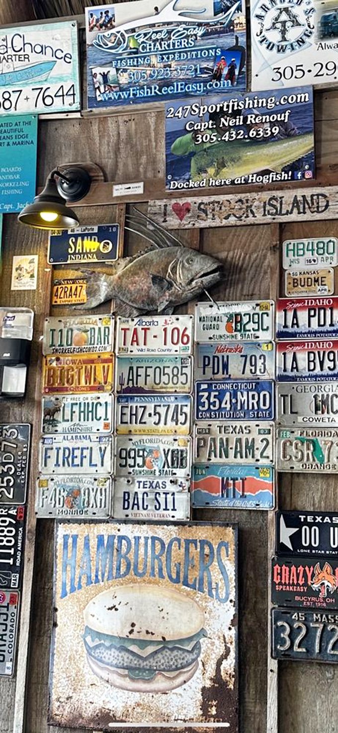 License plates from across America tell the story—people come from everywhere, leaving a piece of home on walls that welcome all.