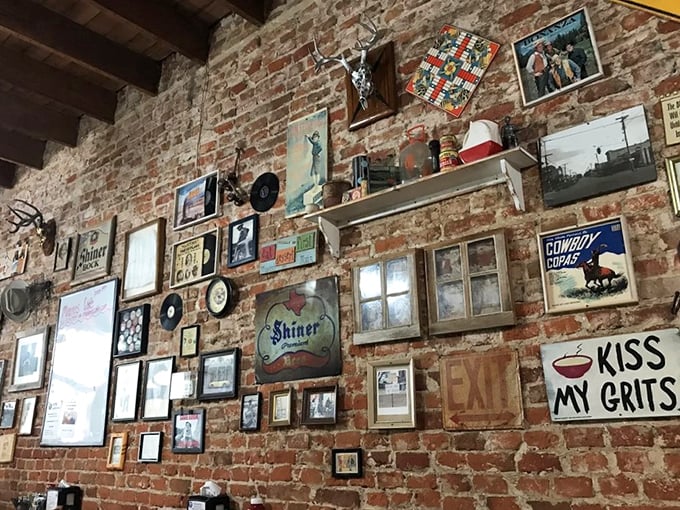 "Kiss My Grits" isn't just a wall decoration—it's practically the Texas state motto. This wall tells more stories than your grandpa after two beers.