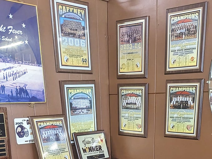 The wall of local sports memorabilia tells you everything—this isn't just a restaurant; it's a community gathering place where victories are celebrated.