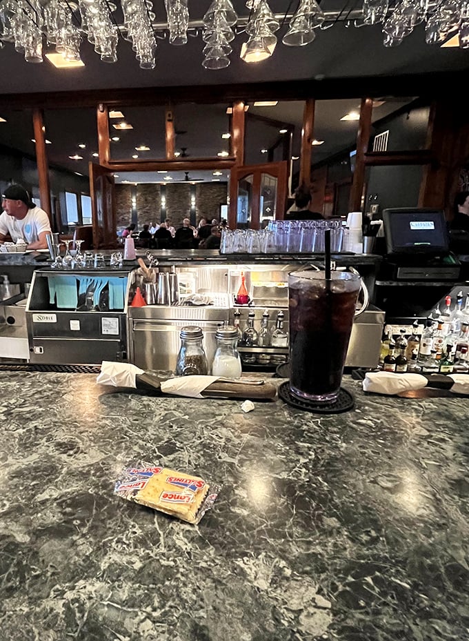 The bar counter—where solo diners become part of the Culhane's family. A marble-topped front row seat to hospitality in action.