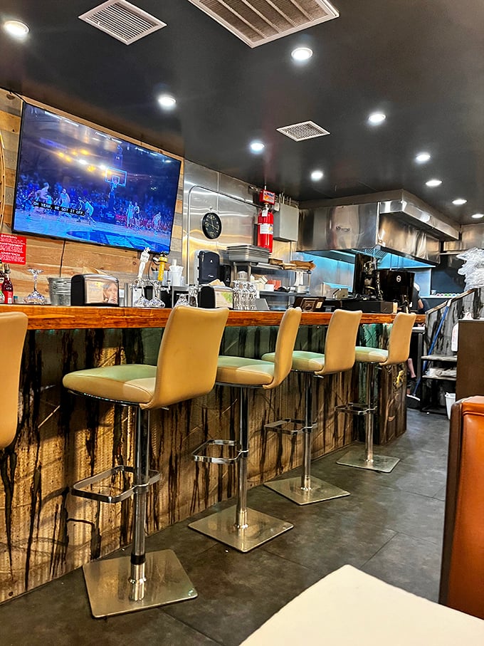 The bar area combines rustic charm with nautical touches—like if a fishing boat and a mountain cabin had a stylish restaurant baby.