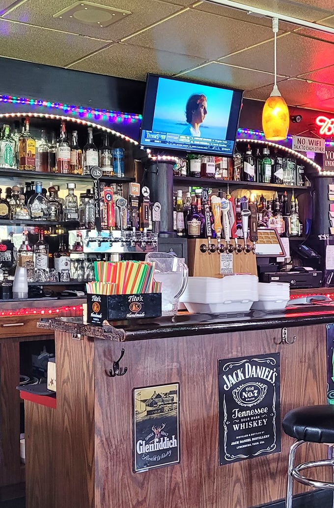 The bar area—where neighborhood stories are exchanged as freely as drink recommendations. A liquid library of spirits and conversation.