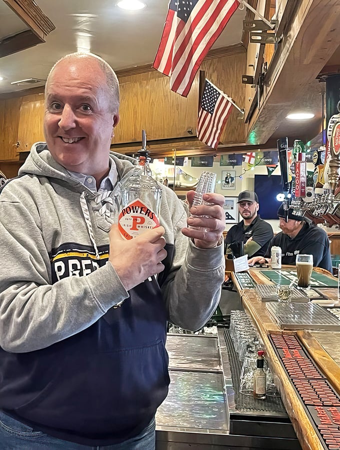 The joy of a proper pour is written all over this patron's face—some moments of pure happiness can only be found at the right bar.