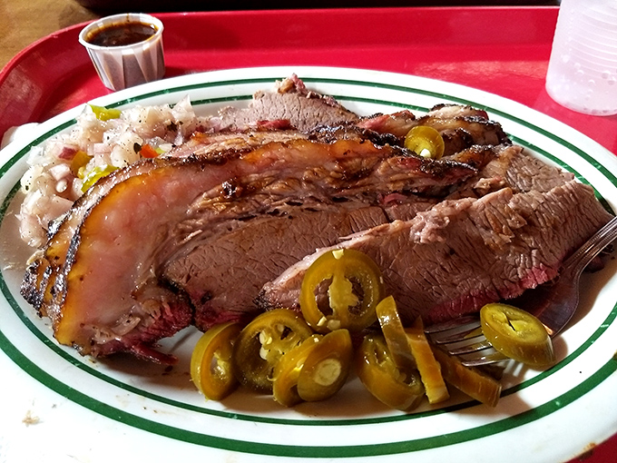 Brisket sliced so perfectly it could make a Texas pitmaster shed a tear of joy. Those pickled jalapeños add just the right kick.