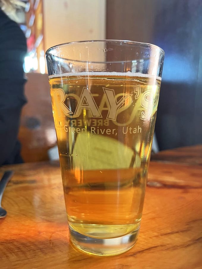 Even the glassware tells Ray's story – a golden brew in a branded cup, the perfect companion to whatever deliciousness awaits.