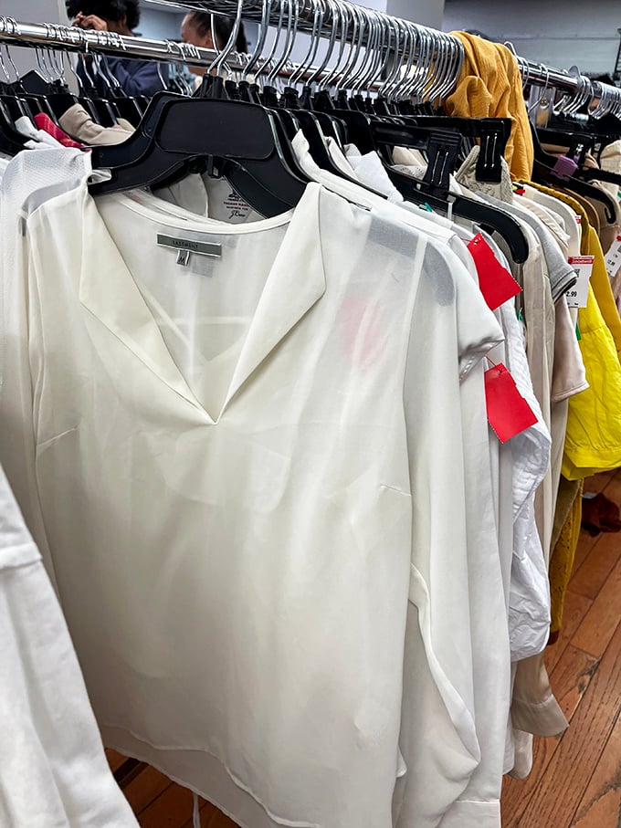 Crisp white blouses hanging like ghosts of corporate meetings past, ready for resurrection in your work-from-home Zoom calls.