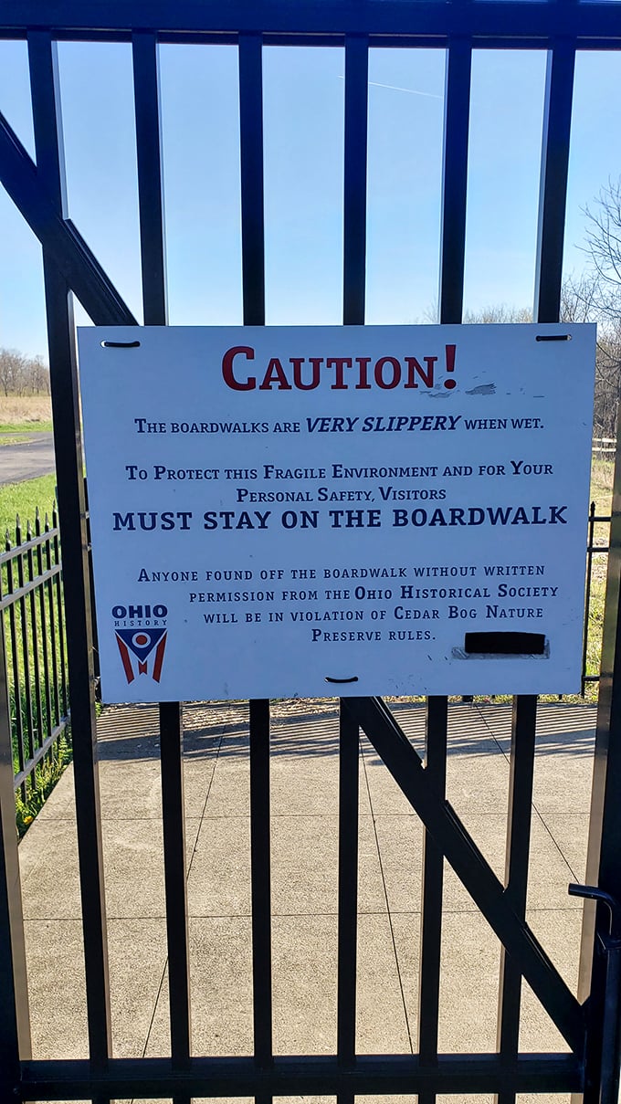 Rules with good reason. This cautionary sign reminds visitors that staying on the boardwalk protects both fragile ecosystems and unwary ankles from unexpected mishaps.