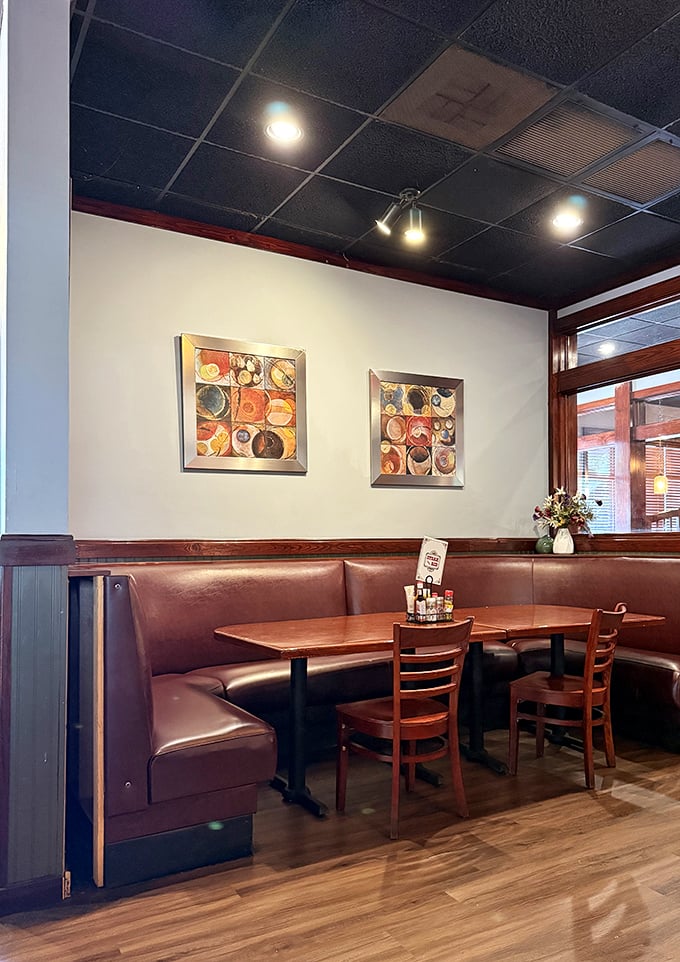These cozy booths aren't just seating—they're private dining rooms where memories are made between bites of perfectly prepared comfort food.