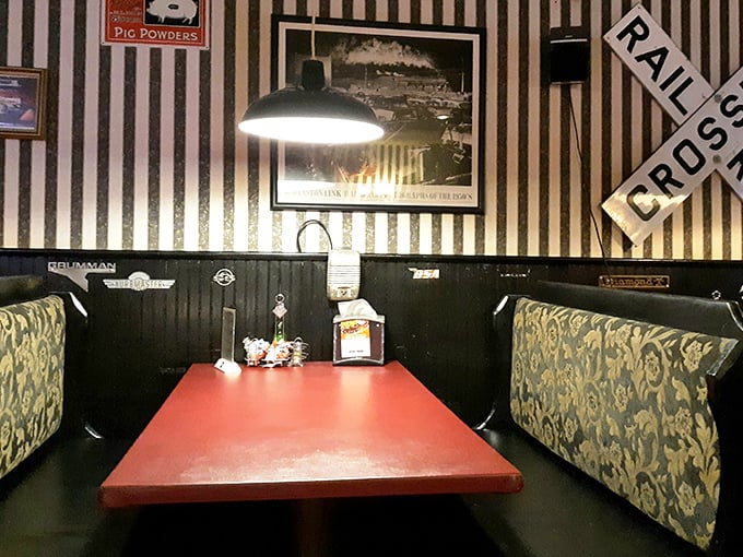 Red tables, striped walls, and railroad signs – this isn't interior decorating, it's a time machine to when restaurants had genuine character.