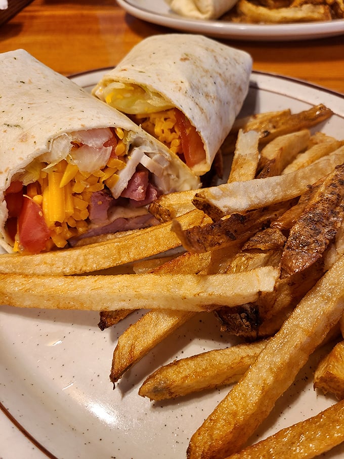 This breakfast wrap doesn't just contain ingredients – it embraces them in a warm tortilla hug alongside those hand-cut fries that shame their frozen cousins.