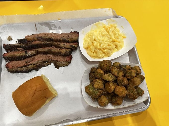 Brisket slices, mac and cheese, and what appear to be fried okra – the holy trinity of Southern comfort arranged on a tray of joy.