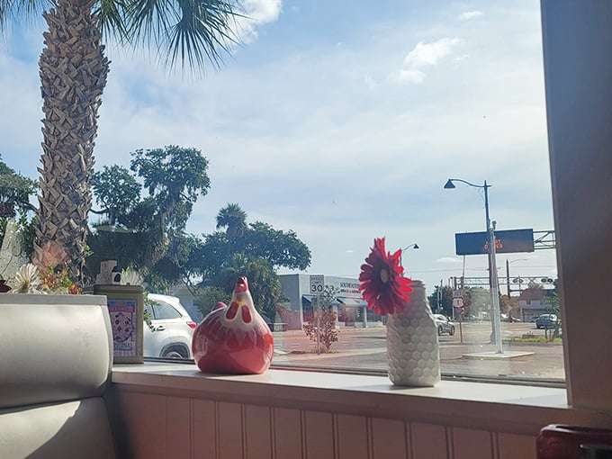 Little touches like ceramic roosters on the windowsill remind you this isn't some corporate chain—it's someone's labor of love.