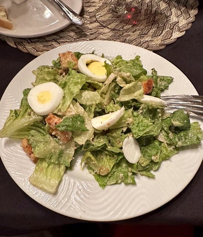 A Caesar salad that Julius himself would approve of—crisp romaine, perfect dressing distribution, and those eggs adding a touch of richness.