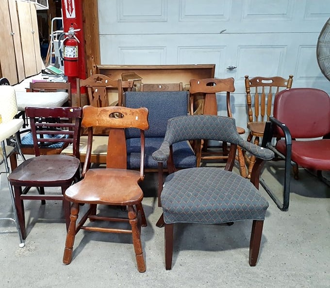 The chair gathering looks like a furniture family reunion—mid-century modern cousins mingling with country antique aunts and office chair uncles.