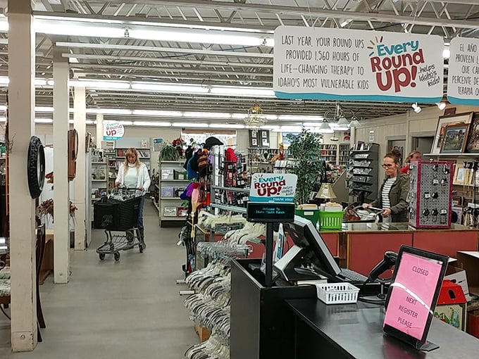 The "Round Up" program banner reminds shoppers that their spare change funds real change in vulnerable children's lives.