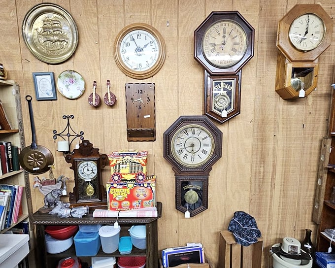 The wall where time stands still—literally. These pendulum clocks have been ticking away decades, each face telling a different story of American craftsmanship.