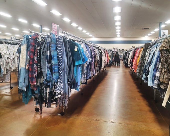 The shirt corridor, where flannel dreams and business casual aspirations hang side by side. Fashion democracy at its finest—all styles welcome, all budgets accommodated.