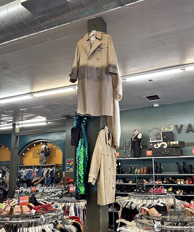 That trench coat hanging from the ceiling isn't just dramatic decor—it's a beacon signaling "serious fashion happens here" to passersby.