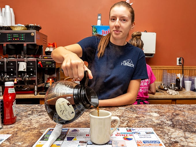 The sacred morning ritual—fresh coffee being poured with precision. Some would call it breakfast foreplay.