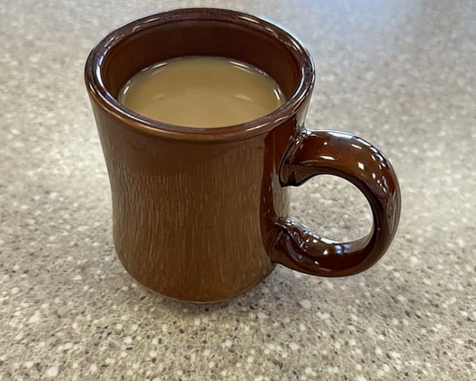 The humble brown coffee mug – delivering liquid motivation since forever. In Vegas, this might be the most reliable bet you'll make all day.