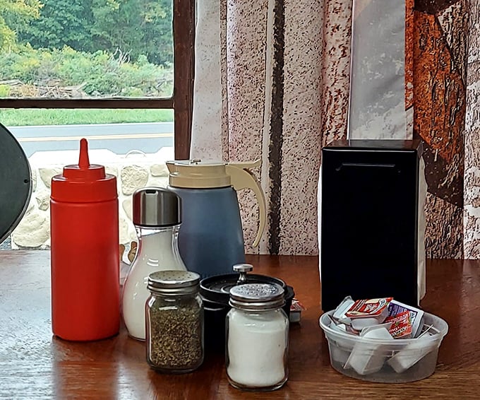 The table essentials: ketchup, salt, pepper, and sugar packets. Simple condiments for food that doesn't need much dressing up to shine.