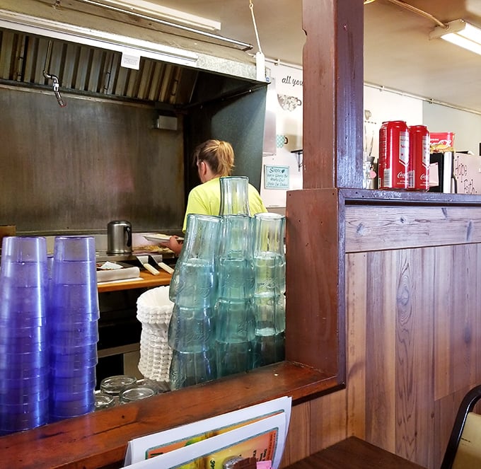 Behind the scenes, where the magic happens. Those stacked glasses await their destiny—to deliver sweet tea to thirsty patrons.