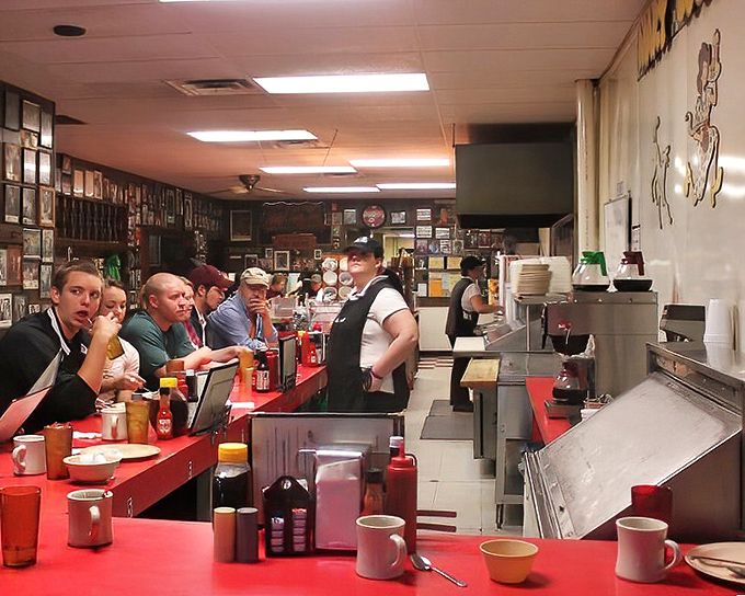 The counter culture of Mary Lou's—where regulars and newcomers alike gather for coffee and conversation. The red countertop has heard every local story worth telling.