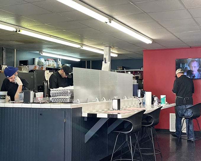 The counter seating offers front-row tickets to the sandwich-making show. Like watching culinary jazz—improvised yet precise.
