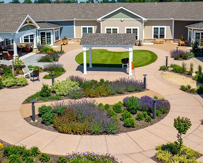 The courtyard's thoughtful design proves that landscaping isn't just decoration—it's an invitation to live more of life outdoors.